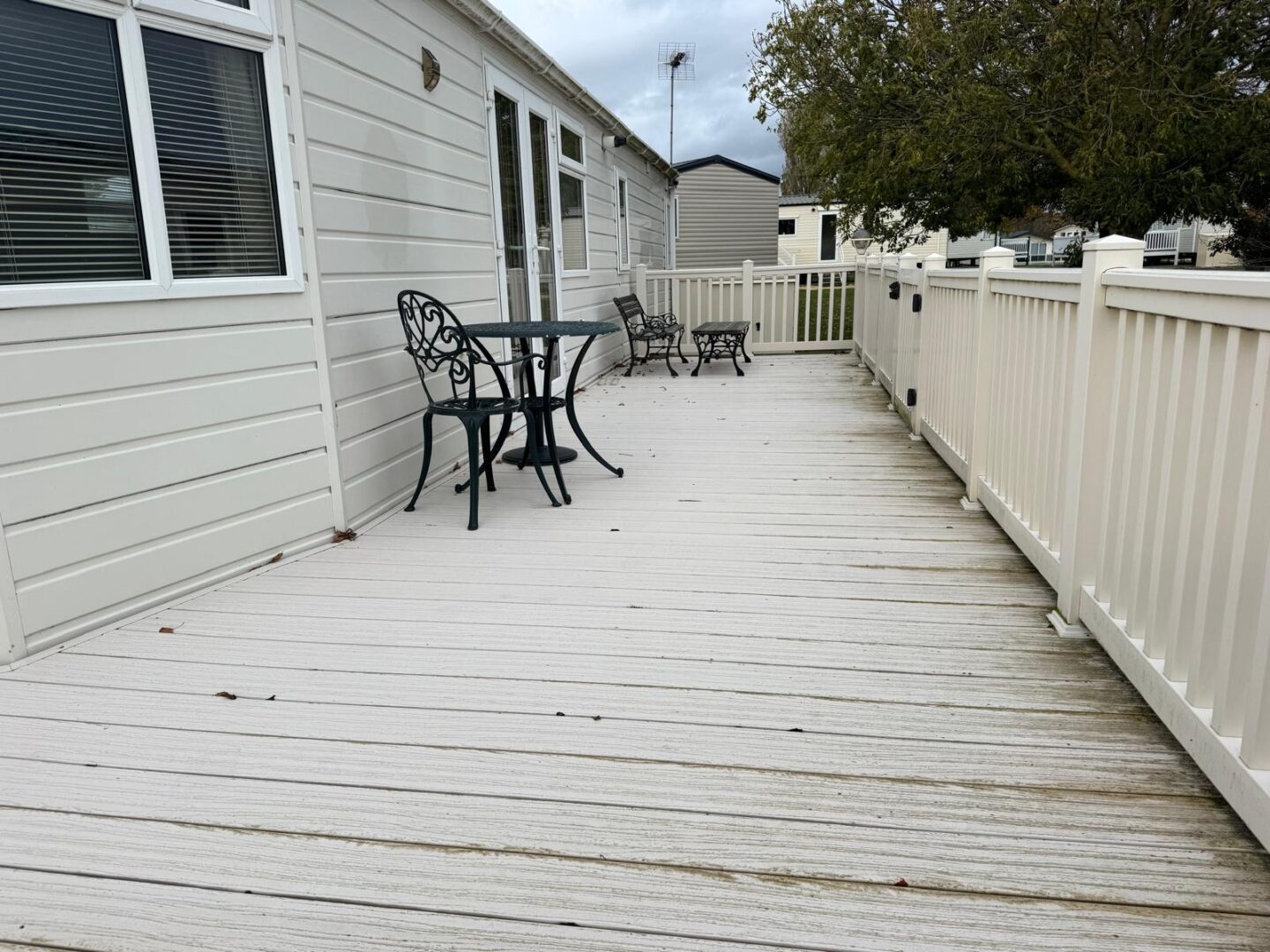 UPVC Static caravan decking with secure gate and steps - Super Leisure