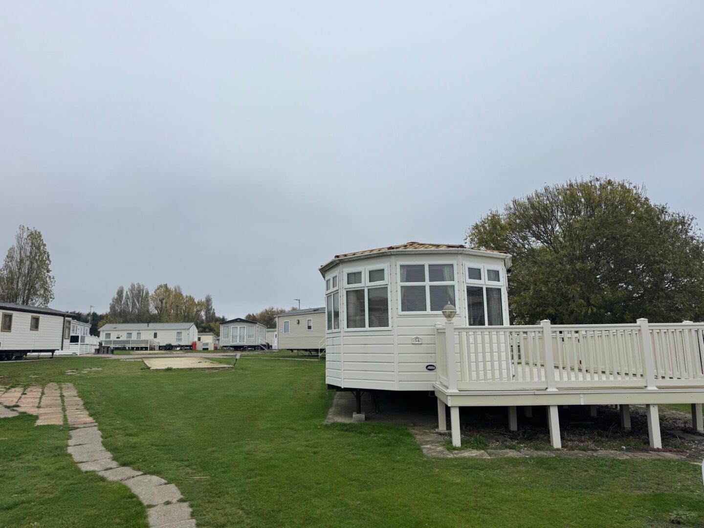 UPVC Static caravan decking with secure gate and steps - Super Leisure